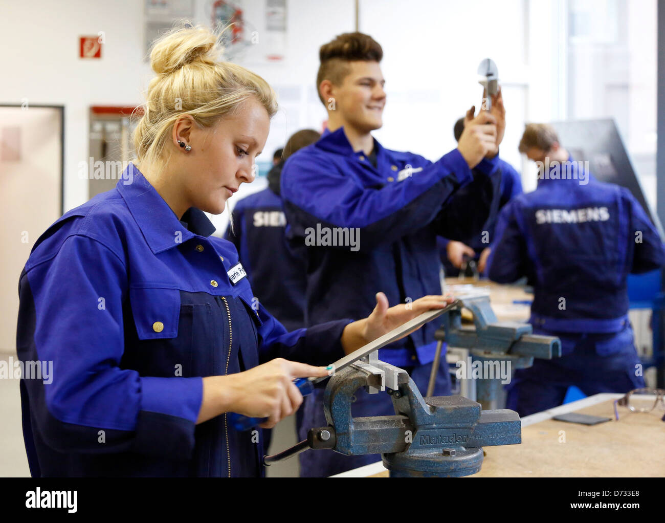 Krefeld, Germany, Siemens Mobility trainees at the workbench Stock ...