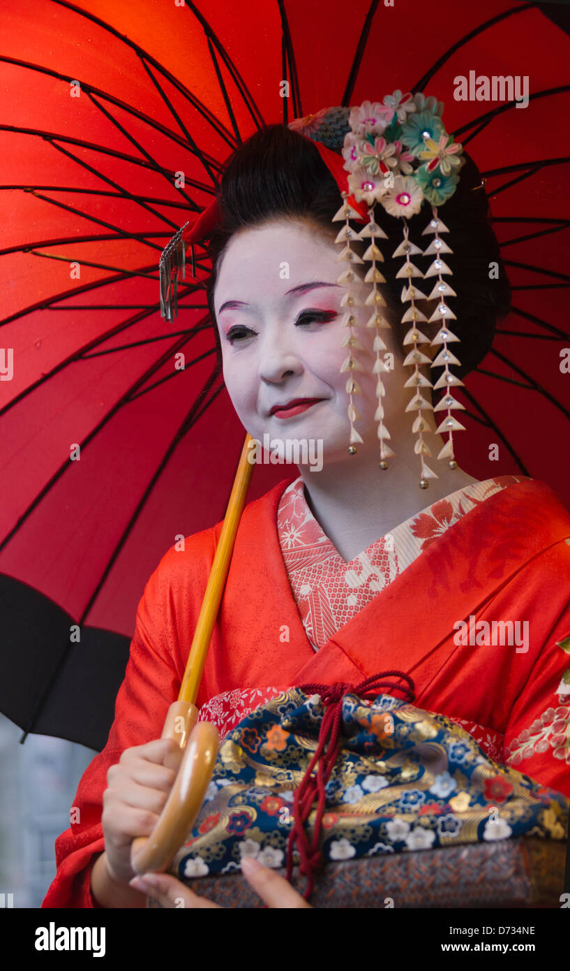 Geisha in kimono with red umbrella, Asakusa, Tokyo, Japan Stock Photo ...