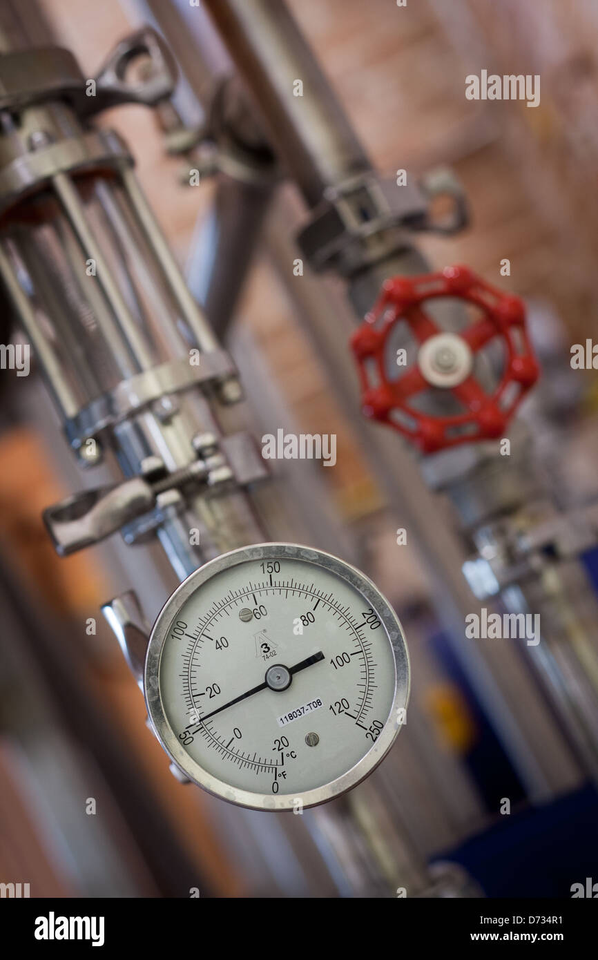 Temperature guage attached to stainless steel pipework with red valve ...