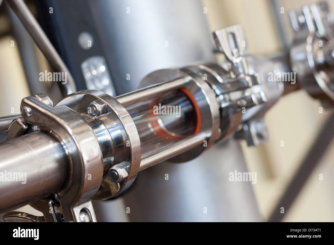 Stainless steel flow tube with near couplings in focus Stock Photo - Alamy
