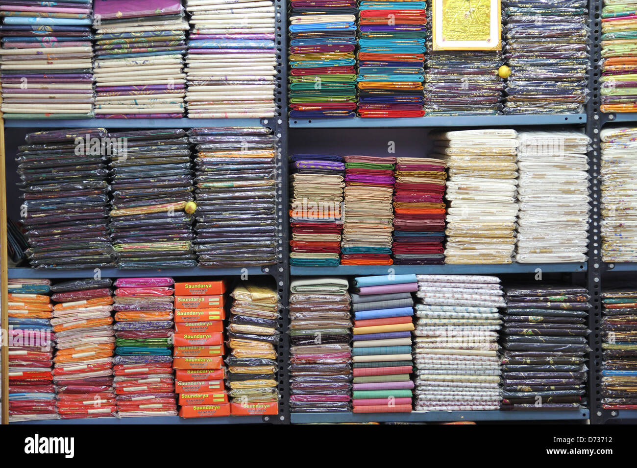 Sarees arranged in stacks Stock Photo - Alamy