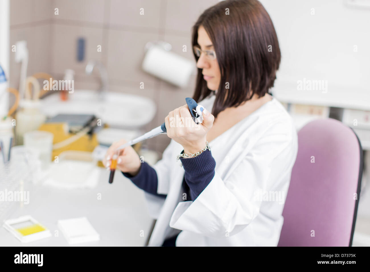 Female medical technician at work Stock Photo - Alamy