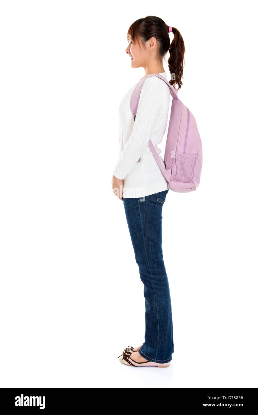 Full body side view of Asian female young adult student standing ...
