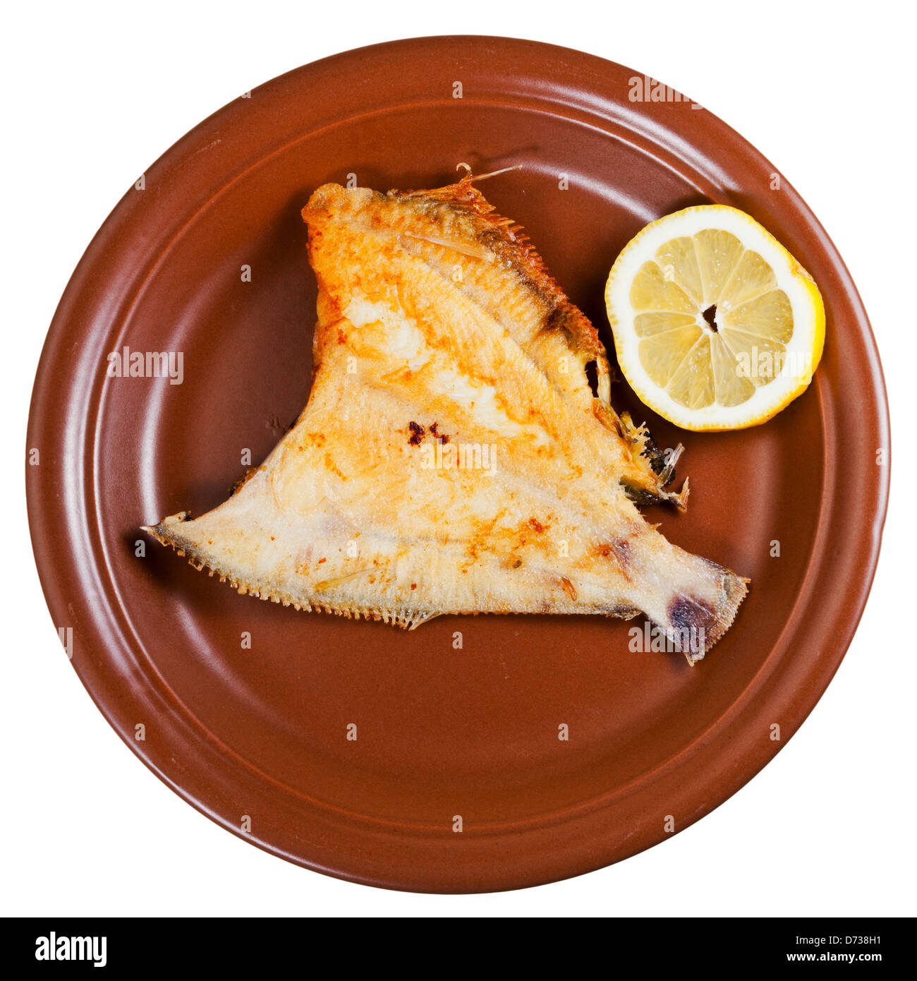 top view of fried sole fish on brown plate isolatd on white background ...