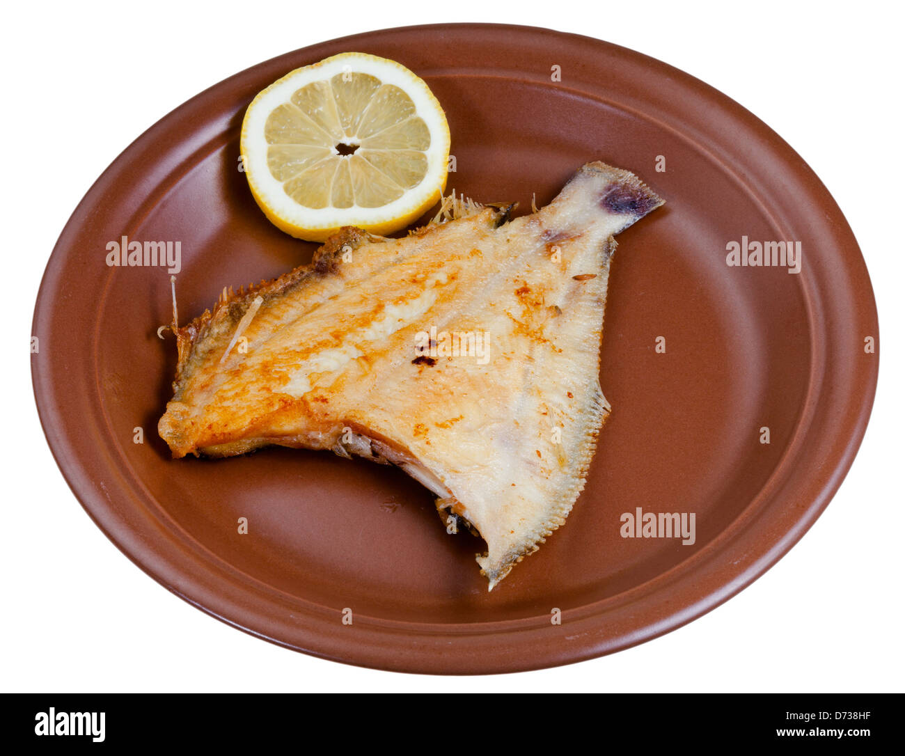 fried sole fish on brown plate isolated on white background Stock Photo ...