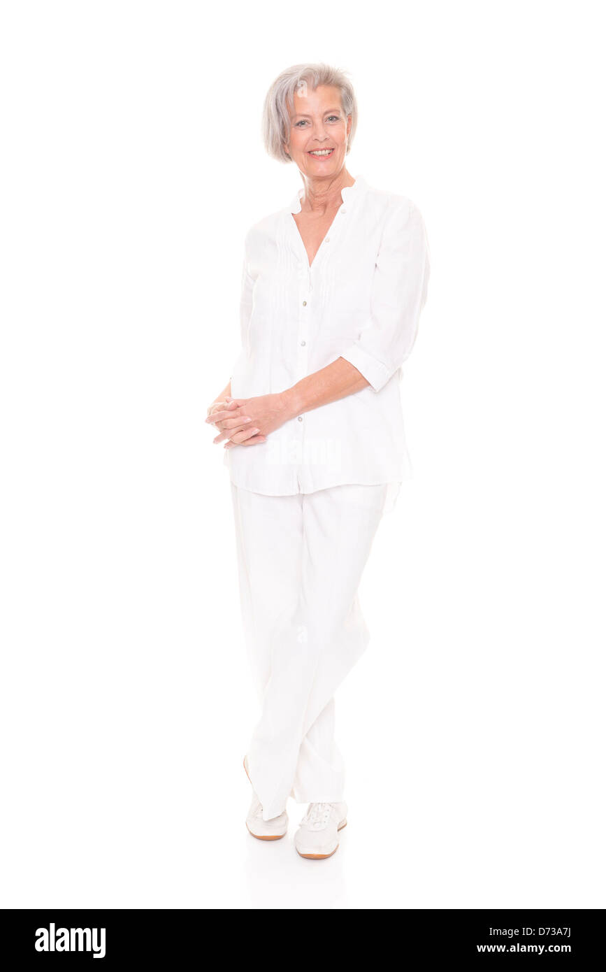 Standing senior woman in front of white background Stock Photo - Alamy