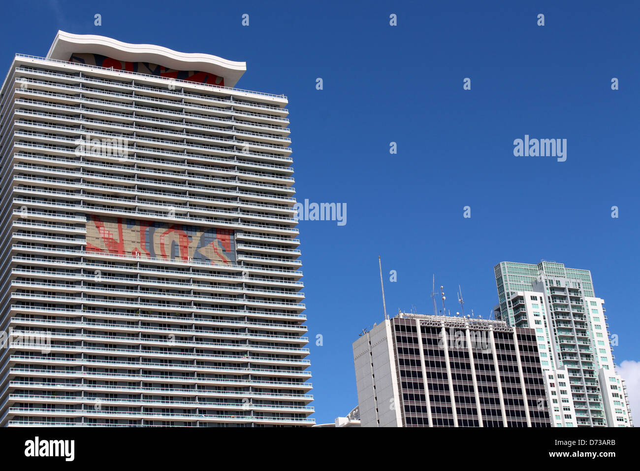 Tall business building with interesting section of color on the side of ...