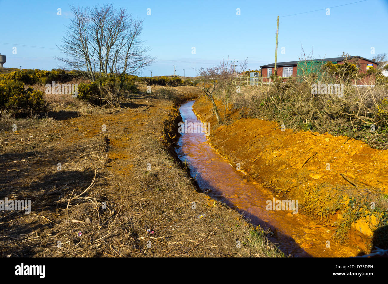 Afon Goch Red river that flows from Parys mountain to Amlwch Port Stock ...
