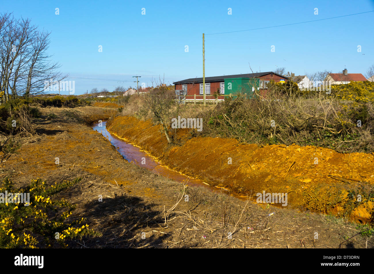 Afon Goch Red river that flows from Parys mountain to Amlwch Port Stock ...