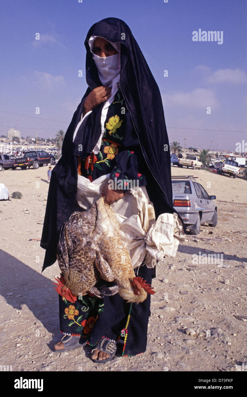 A Bedouin woman from the Tarabin tribe also known as Al-Tirabin sells ...