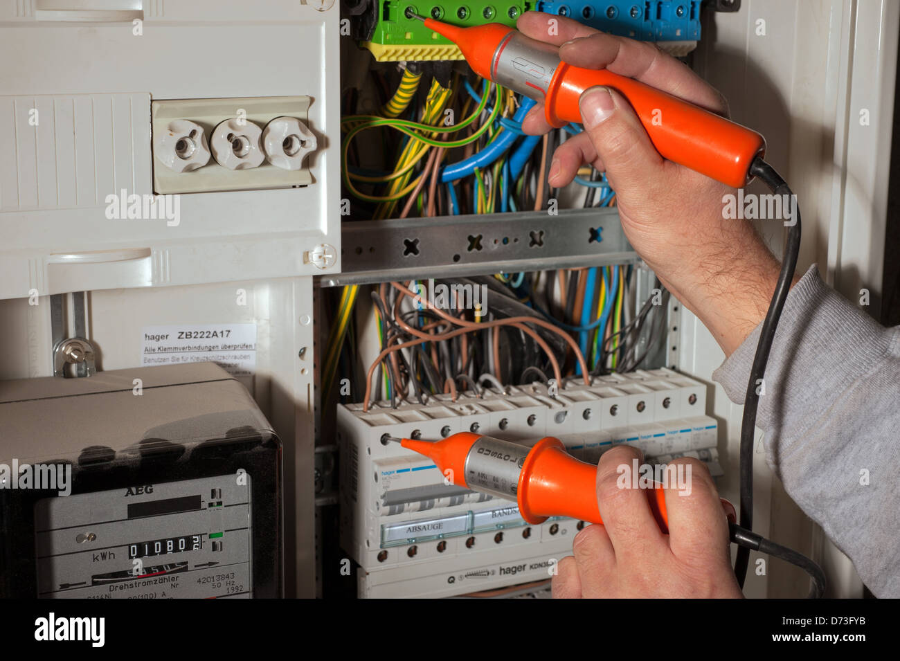 Berlin, Germany, a craftsman inspects a fuse box Stock Photo - Alamy