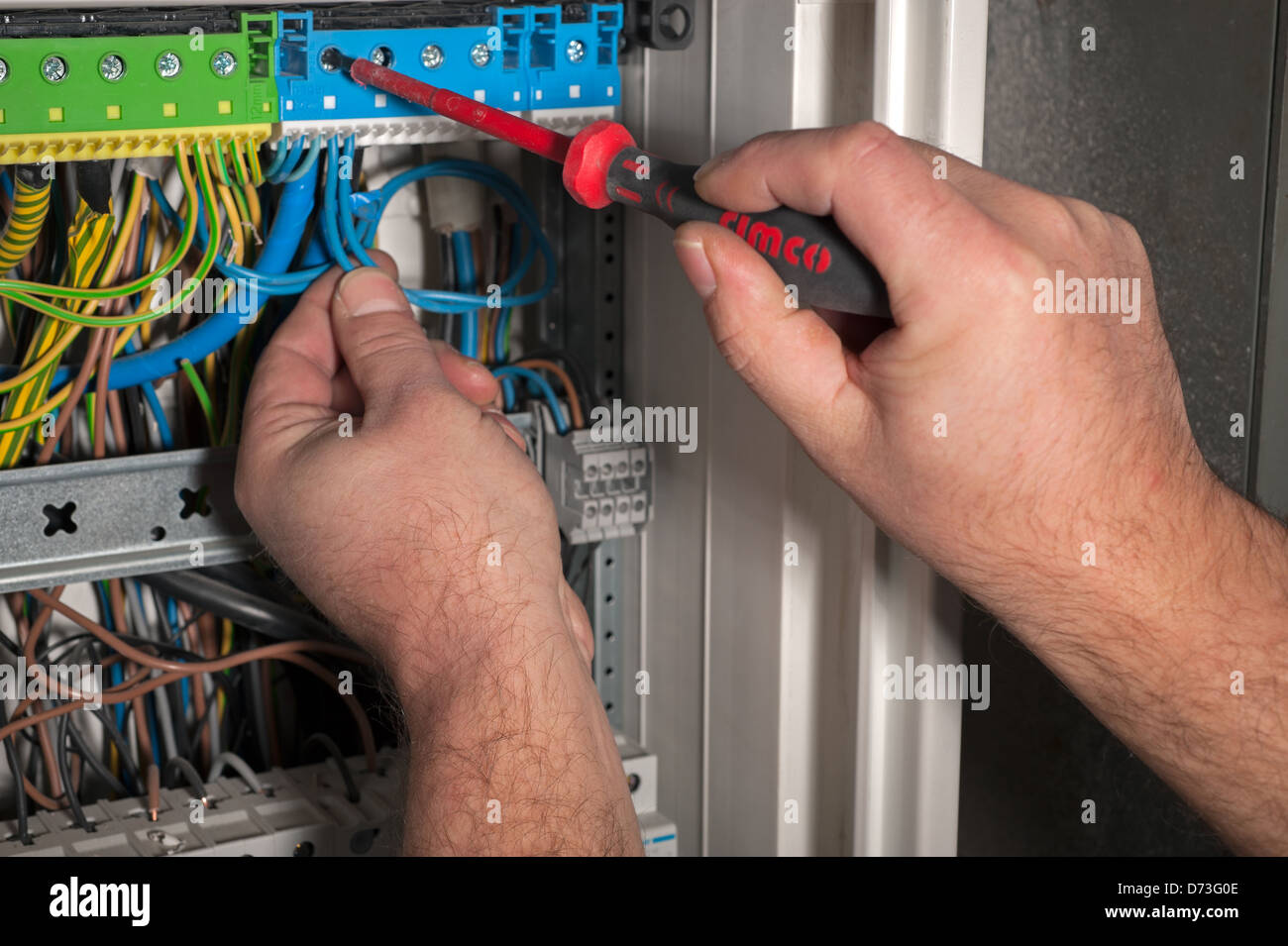 Berlin, Germany, a craftsman screwed to a fuse box Stock Photo - Alamy