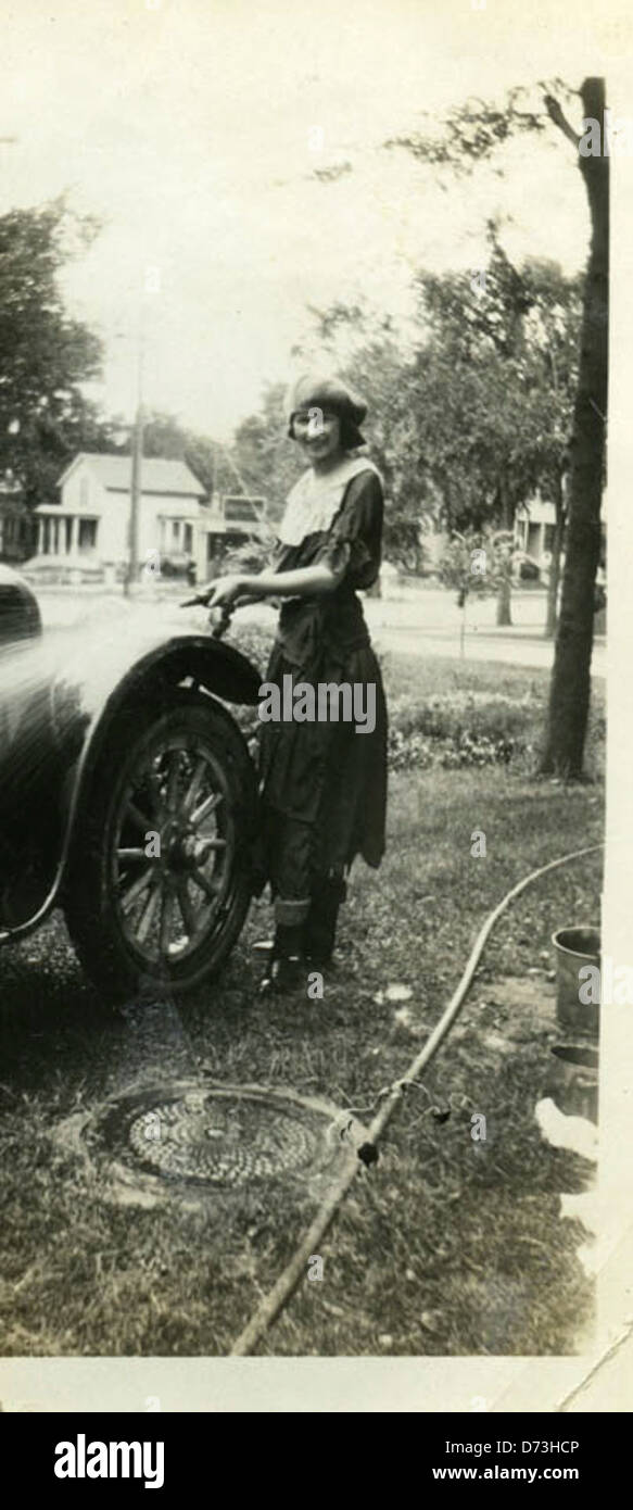 This image shows Jo Agrant washing a car, captured as part of a ...