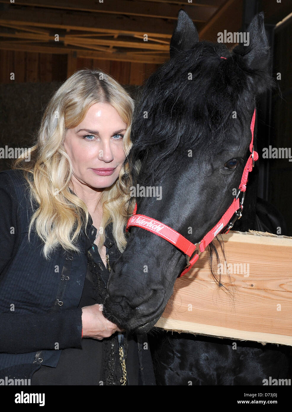US actress Daryl Hannah strokes a horse at the opening of Gut ...