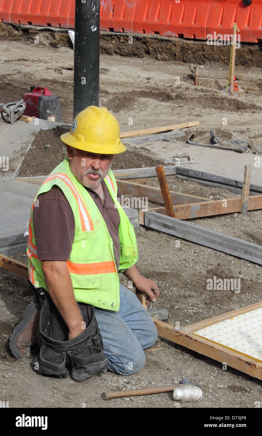 A worker wearing his personal protection equipment while working and ...