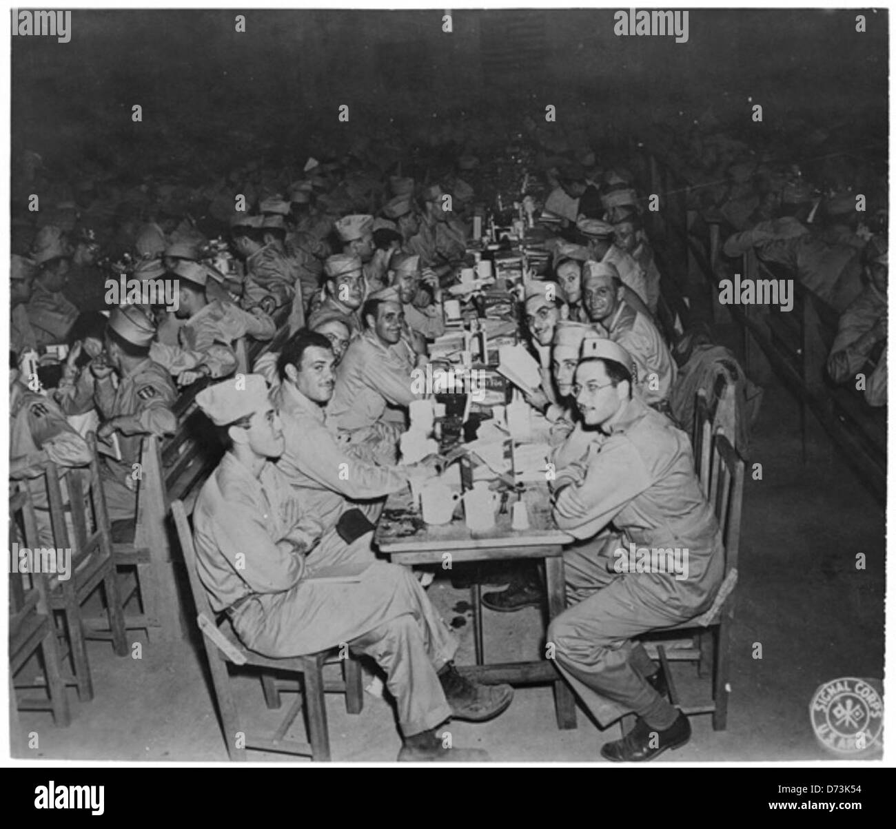 Jewish soldiers gathered at tables for a Passover meal during World War ...