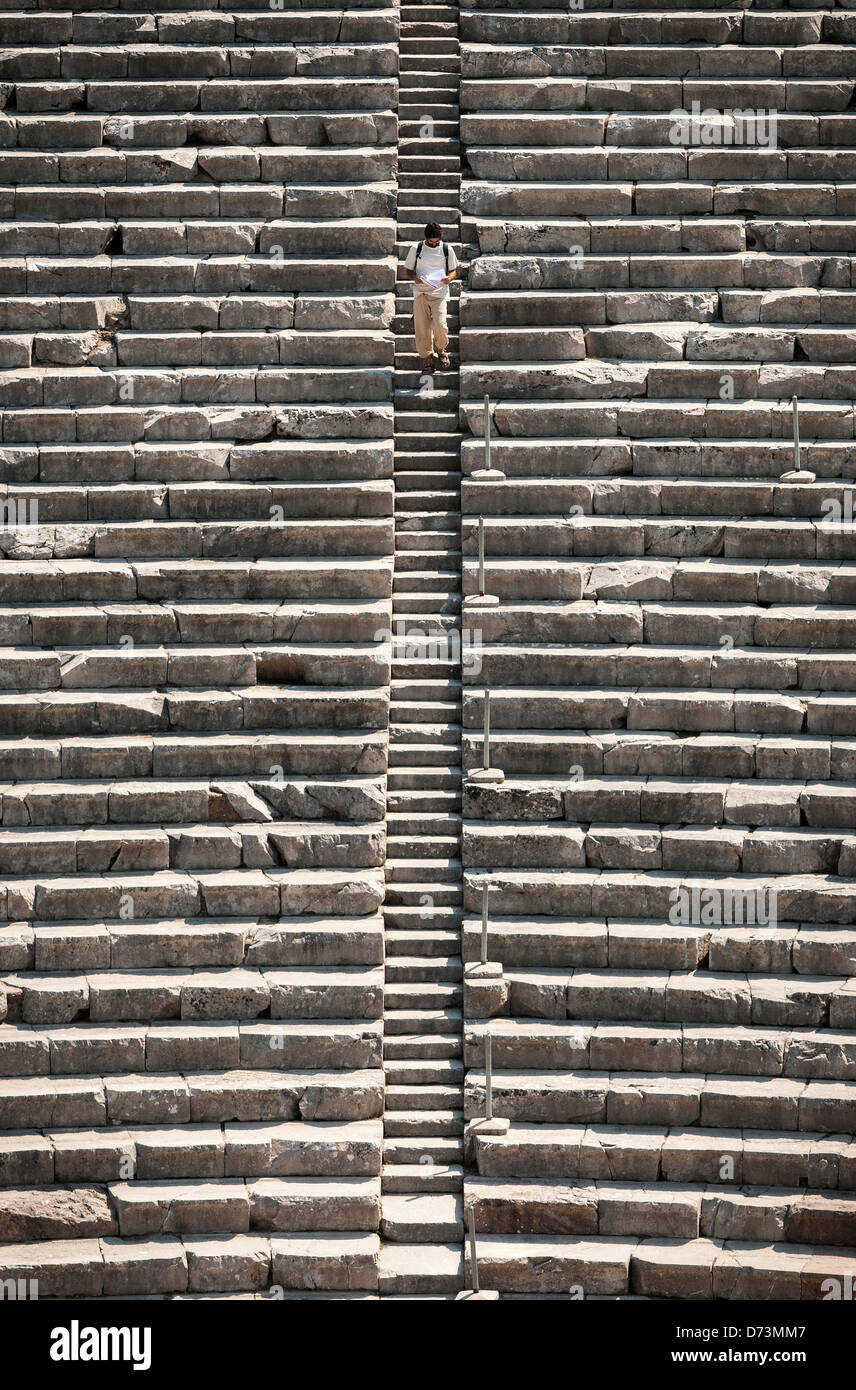A man descending steps at the Classical Greek theater at Ancient ...