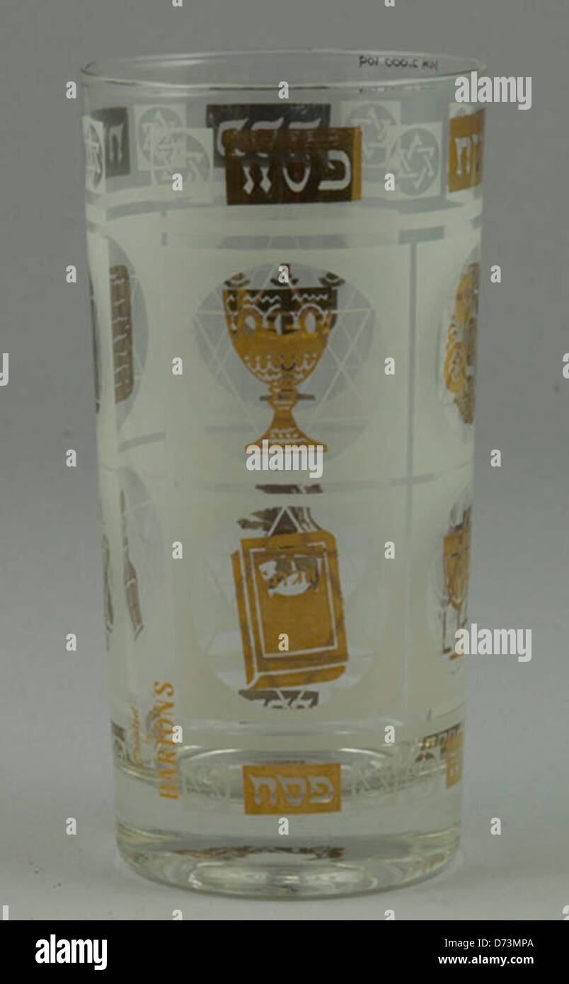This image features a glass decorated with Passover motifs, typically ...