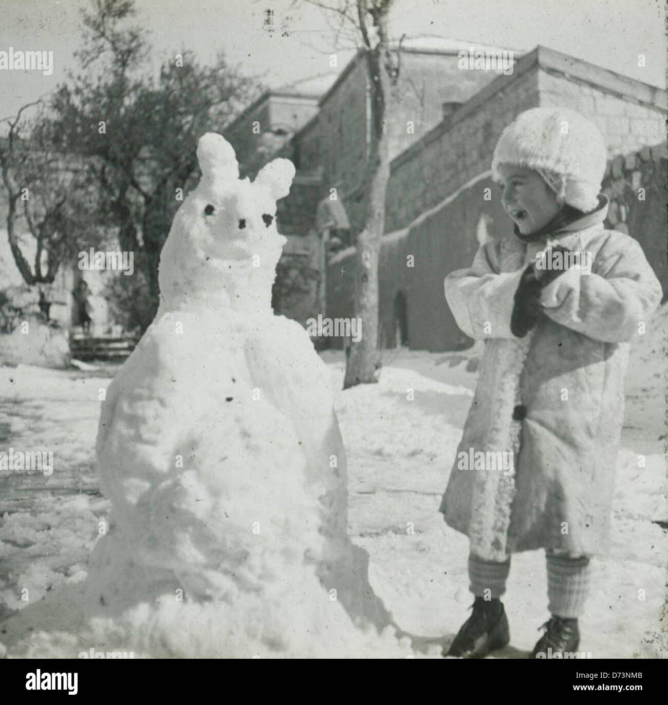 A humorous scene in Jerusalem where a snowman is being constructed ...