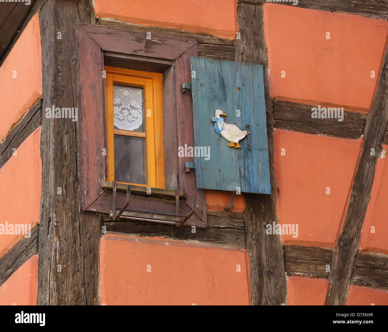 Small window with decorative shutter Stock Photo - Alamy
