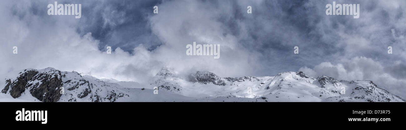Cloudy panorama in Alps Stock Photo - Alamy