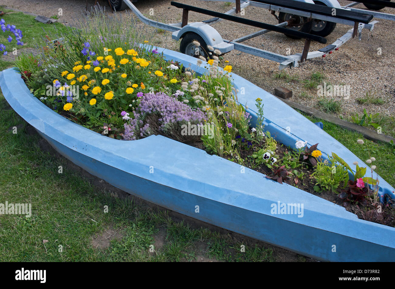 Flowers displayed in a boat Stock Photo - Alamy
