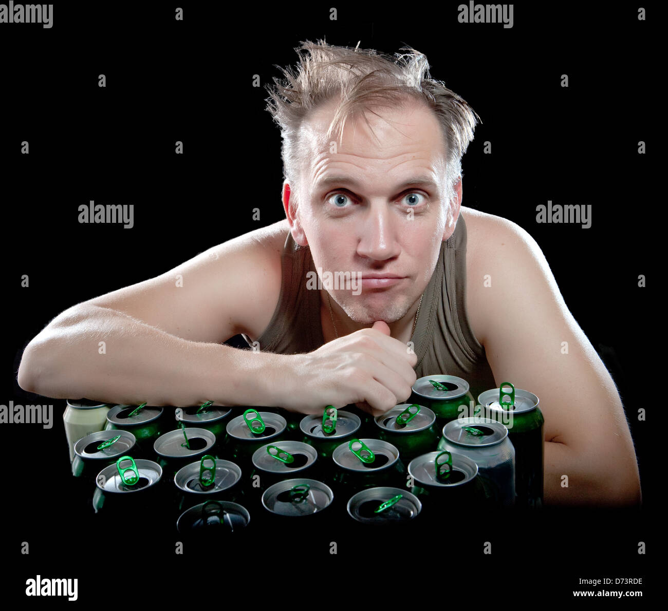 Hangover. Unhealthy man and beer cans Stock Photo - Alamy