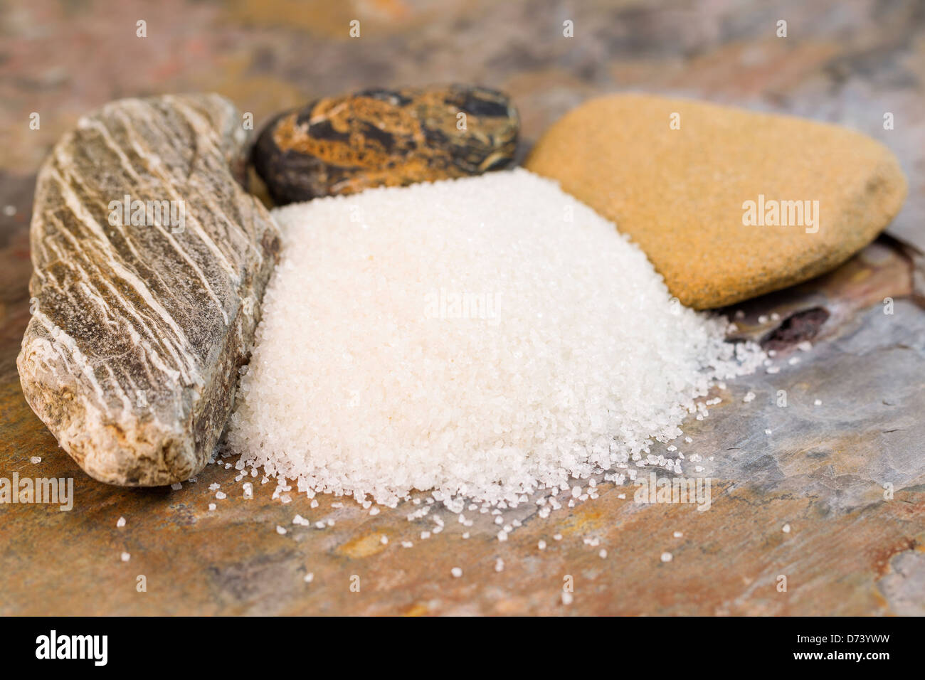 Closeup horizontal photo of coarse salt on a rock surface with rough ...
