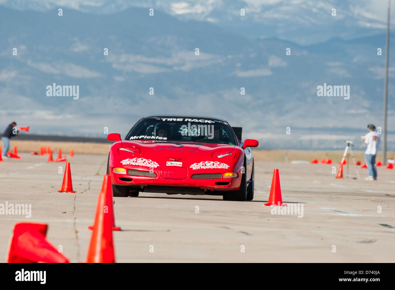 A 1997 red Chevrolet Corvette in an autocross race at a regional Sports ...