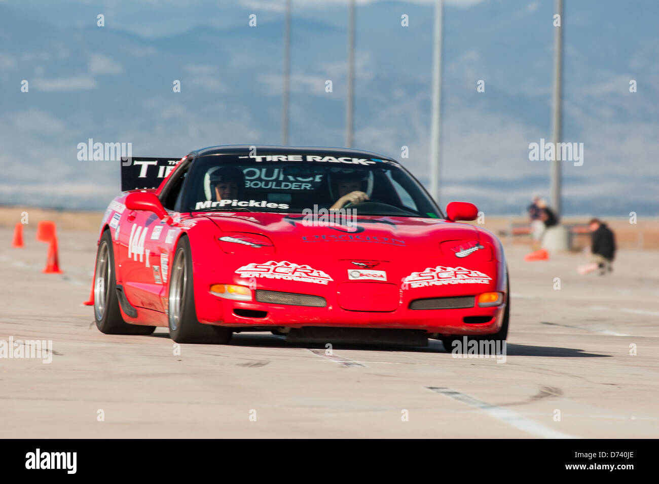 A 1997 red Chevrolet Corvette in an autocross race at a regional Sports ...