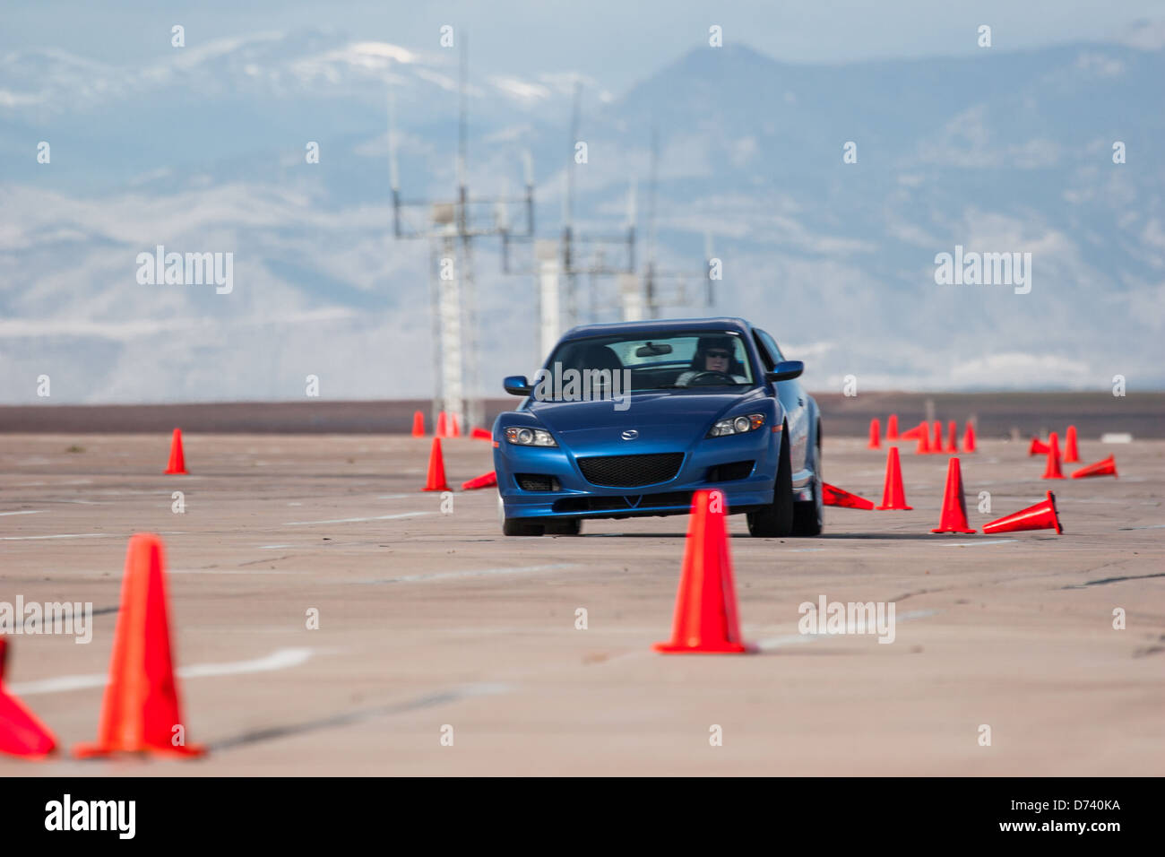 A blue Mazda RX-8 in an autocross race at a regional Sports Car Club of ...