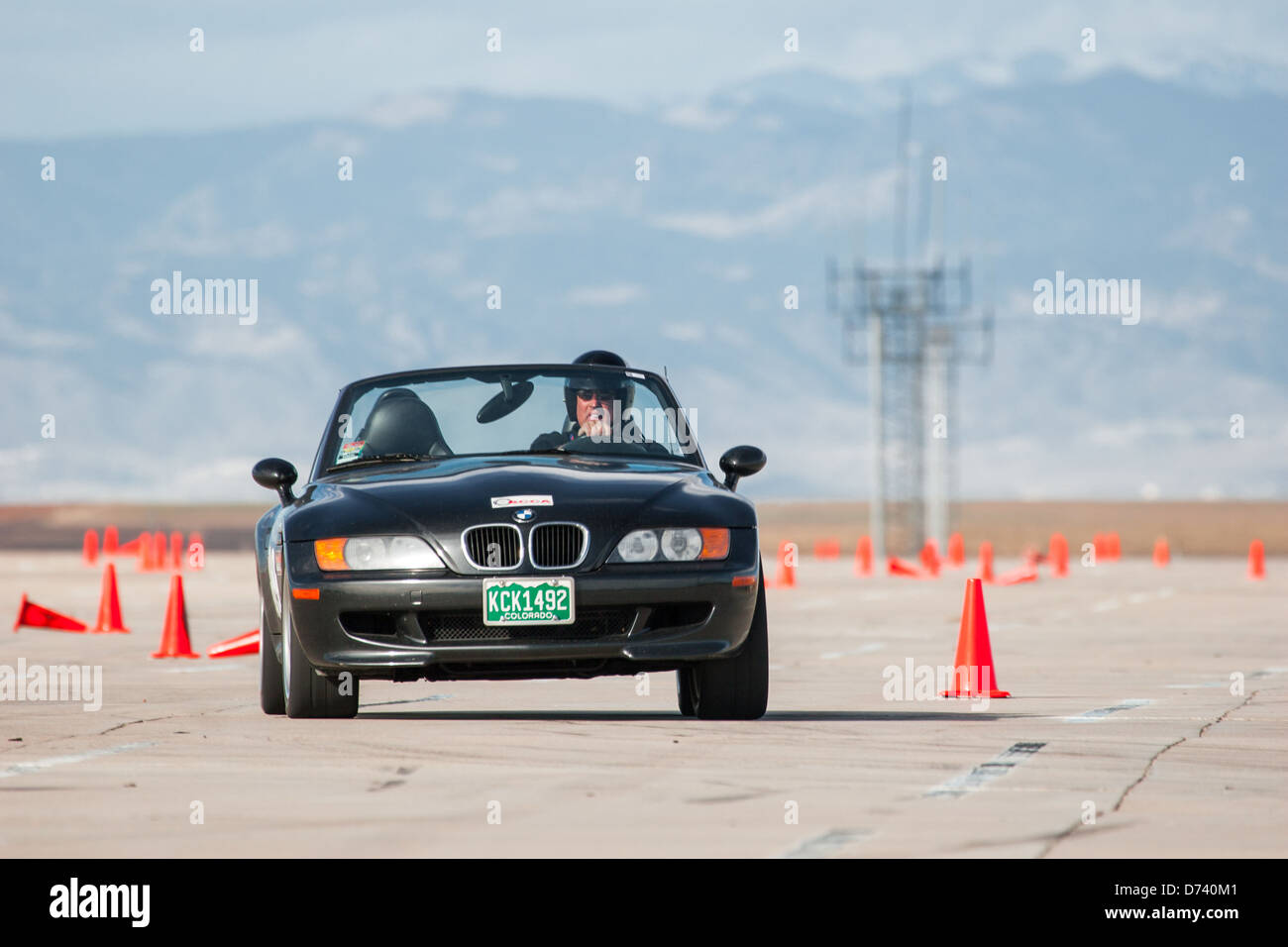 A 1998 Black BMW M Roadster Convertible in an autocross race at a ...