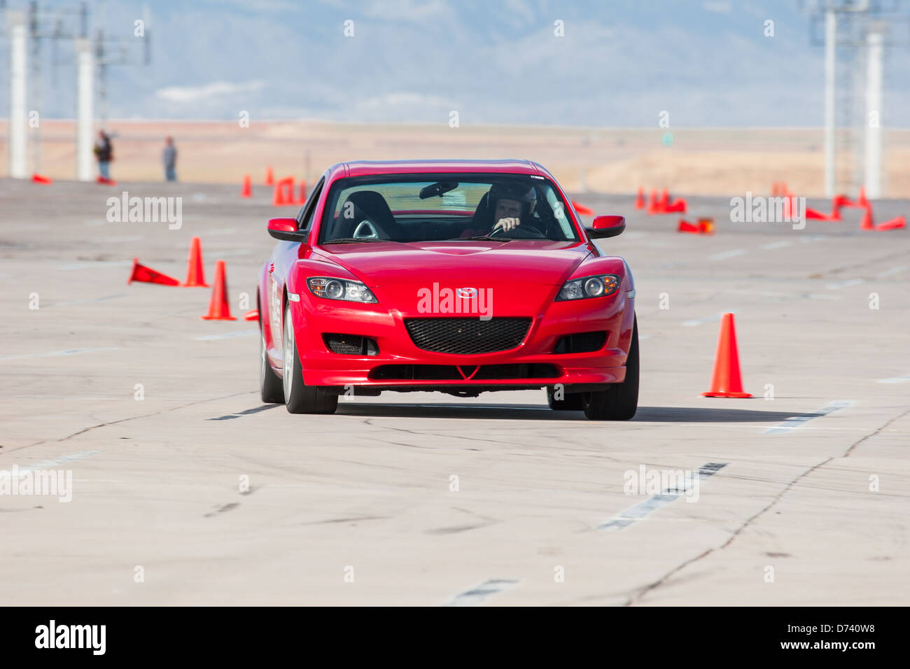 A 2004 Red Mazda RX-8 in an autocross race at a regional Sports Car ...