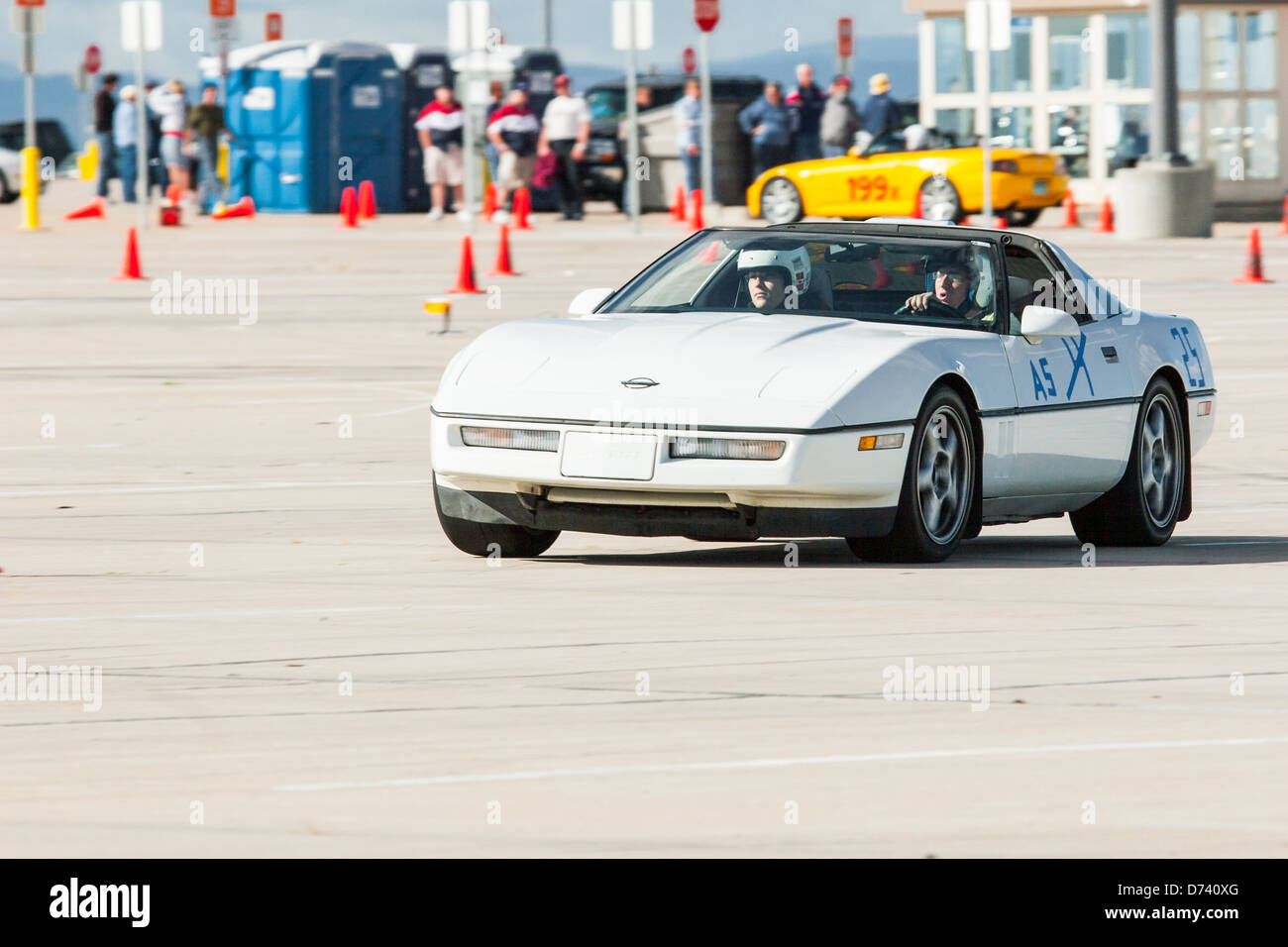 A 1989 White Chevrolet Corvette in an autocross race at a regional ...