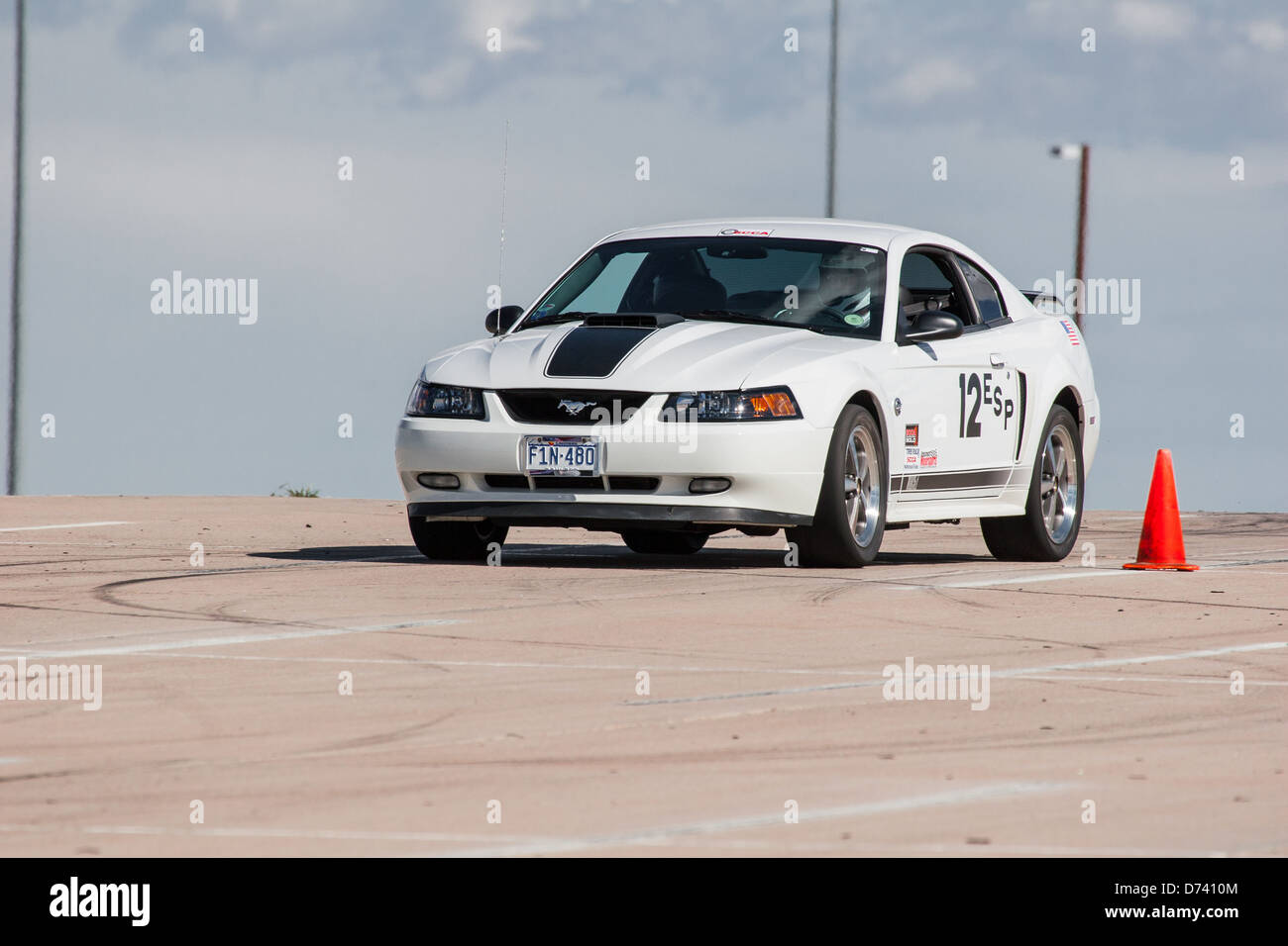 2004 White Ford Mach 1 Mustang in an autocross race at a regional ...