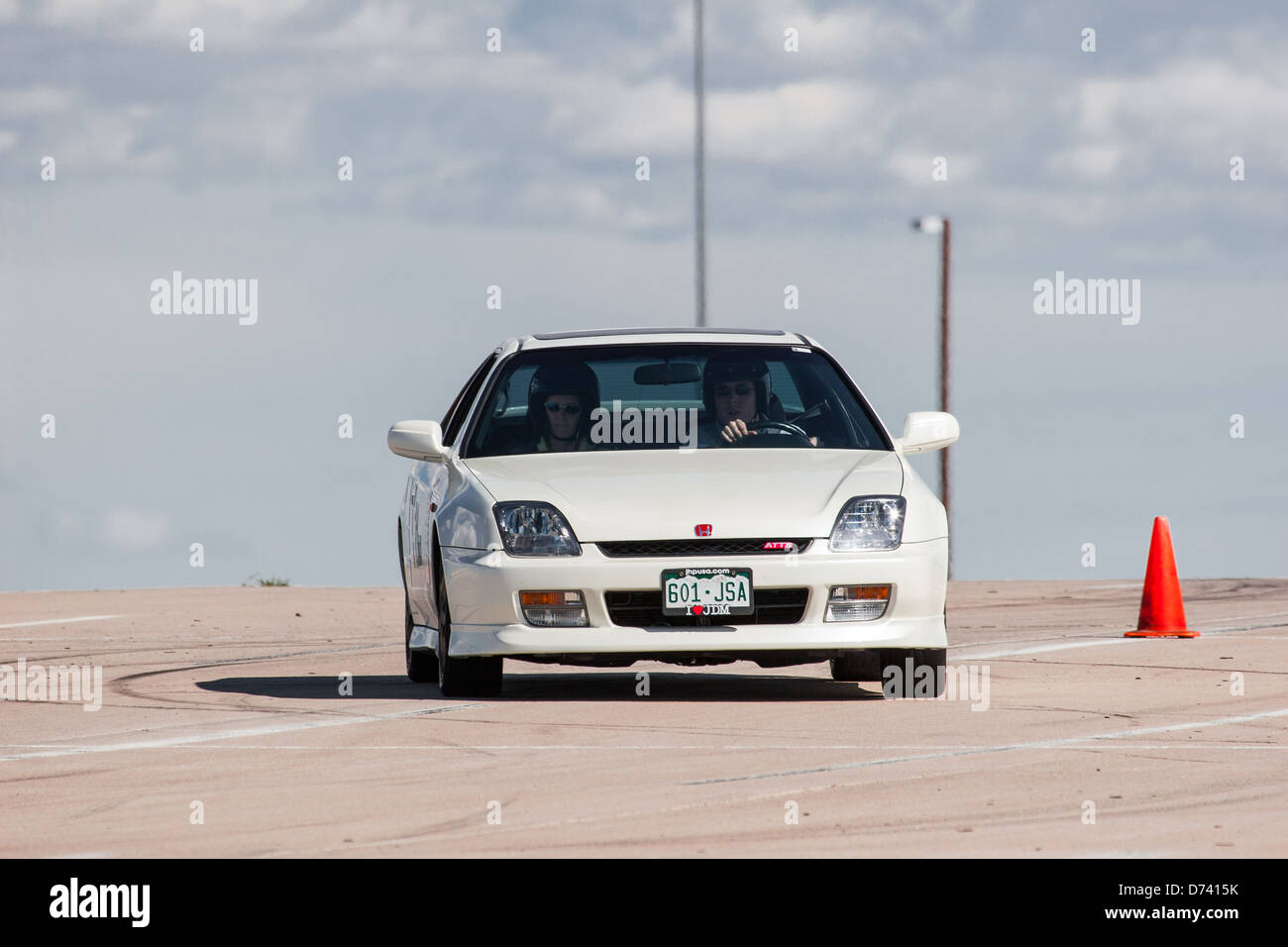 A 1998 White Honda Prelude SH in an autocross race at a regional Sports ...