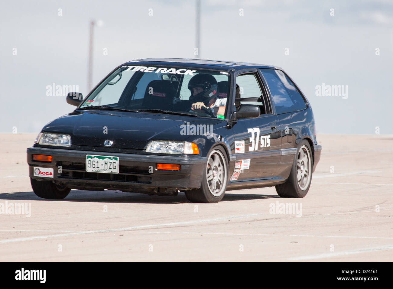 A 1989 Black Honda Civic Si automobile in an autocross race at a ...