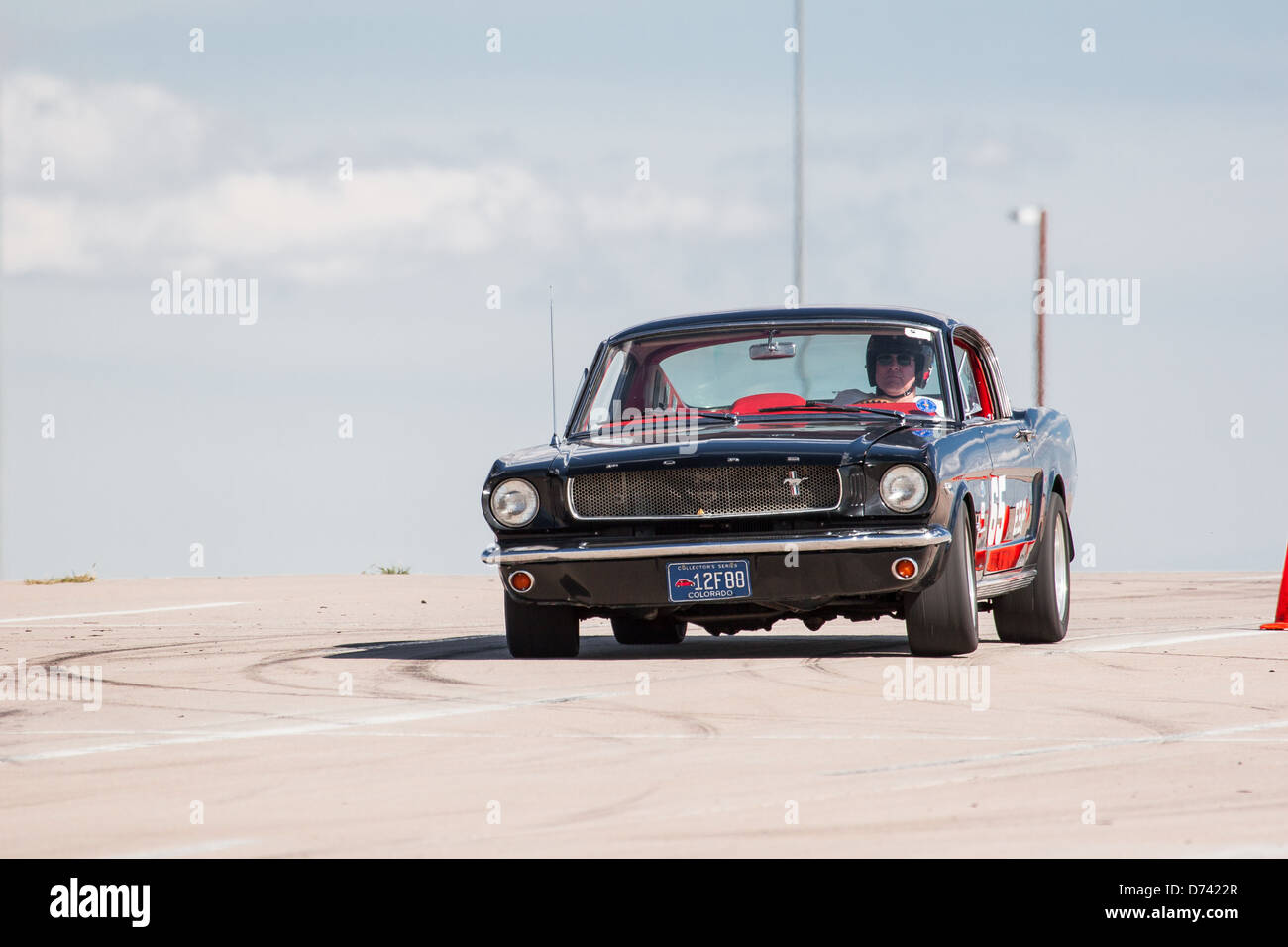 A 1965 Ford Shelby Mustang Fast Back in an autocross race at a regional ...