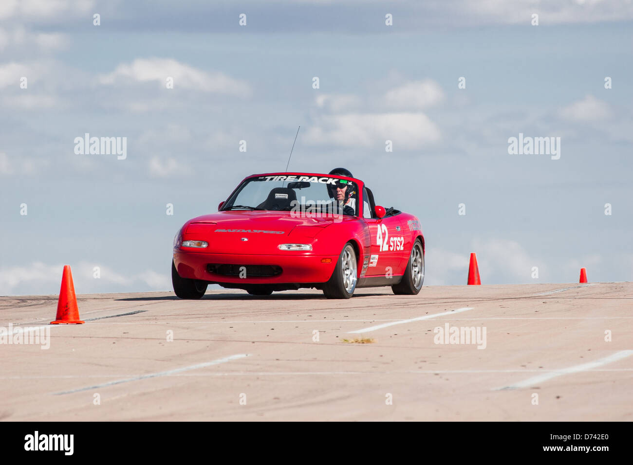 A 1993 Red Mazda Miata in an autocross race at a regional Sports Car ...