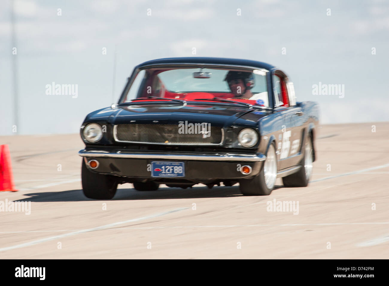 A 1965 Ford Shelby Mustang Fast Back in an autocross race at a regional ...