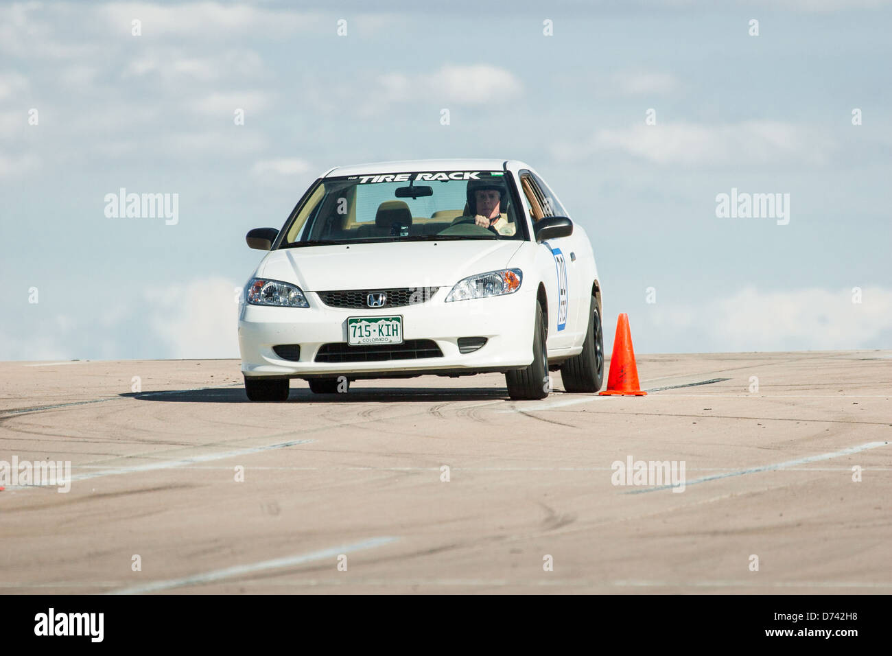 A 2004 White Honda Civic in an autocross race at a regional Sports Car ...