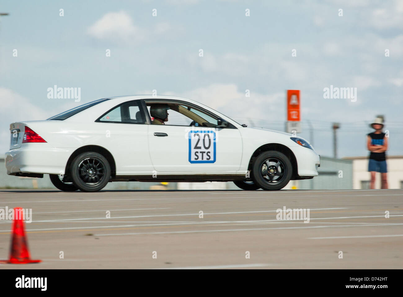 A 2004 White Honda Civic in an autocross race at a regional Sports Car ...