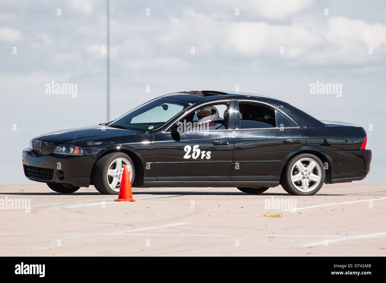 A black sports car in an autocross race at a regional Sports Car Club ...