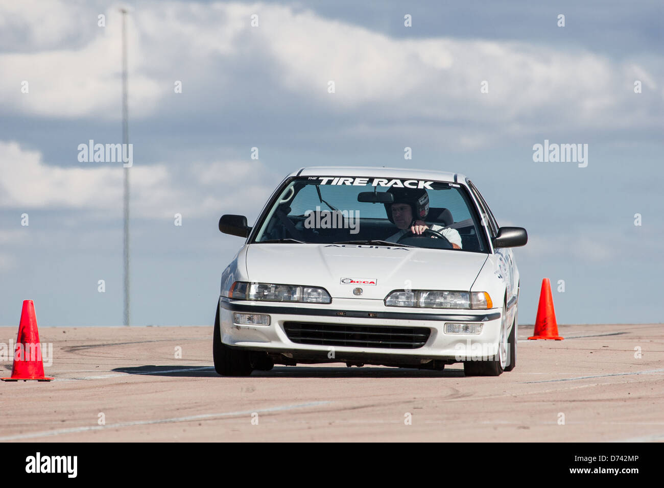 A white sports car in an autocross race at a regional Sports Car Club ...