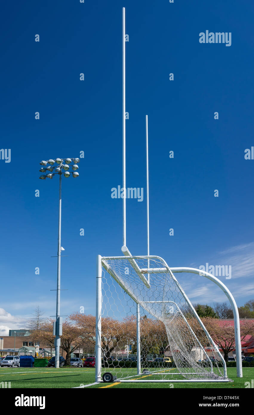 Football and soccer gates on artificial turf field Stock Photo - Alamy