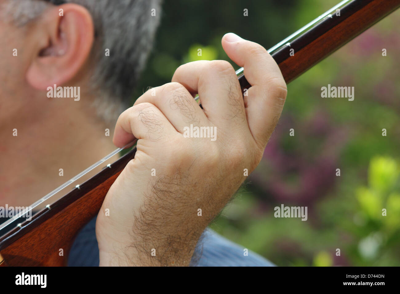 Guitar player play by ear Stock Photo - Alamy