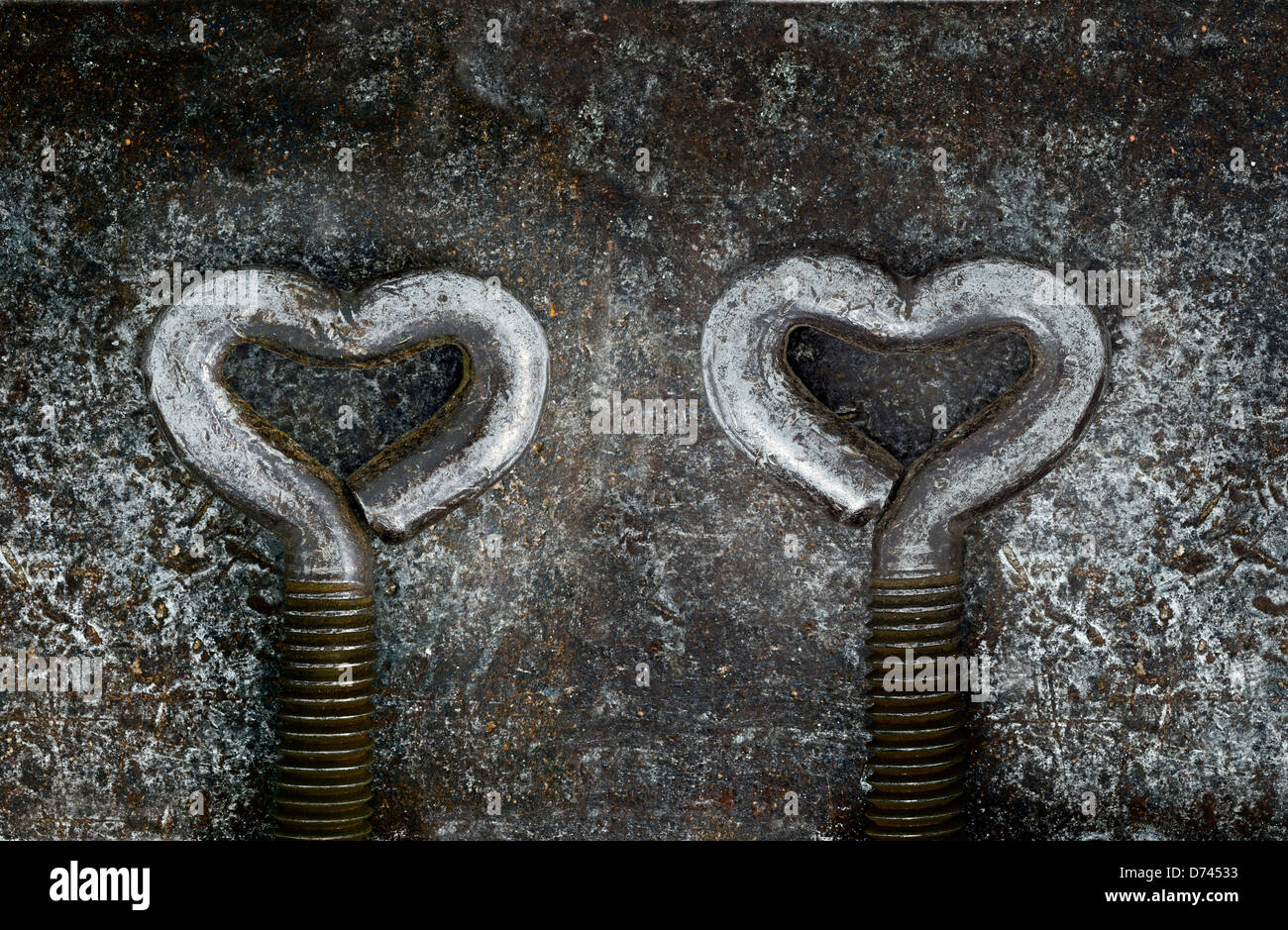 two steel handles shaped heart on a steel background Stock Photo - Alamy