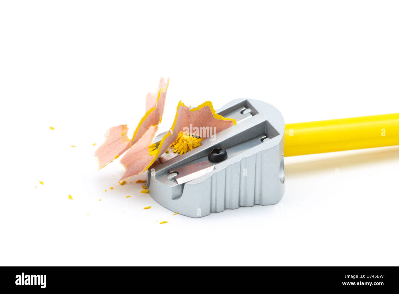 Pencil sharpener with yellow pencil and shavings Stock Photo - Alamy