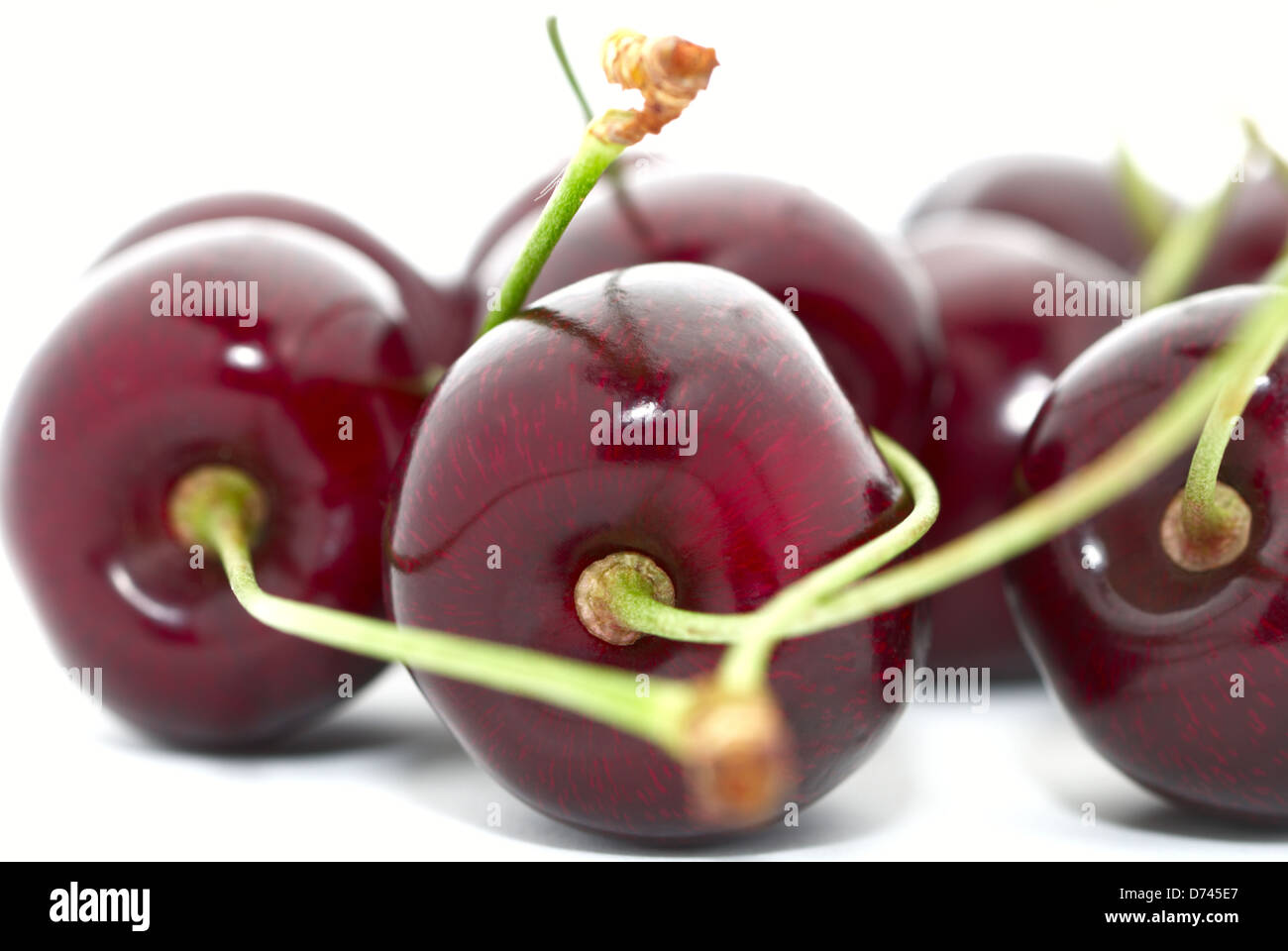 Cherries closeup isolated on white Stock Photo - Alamy