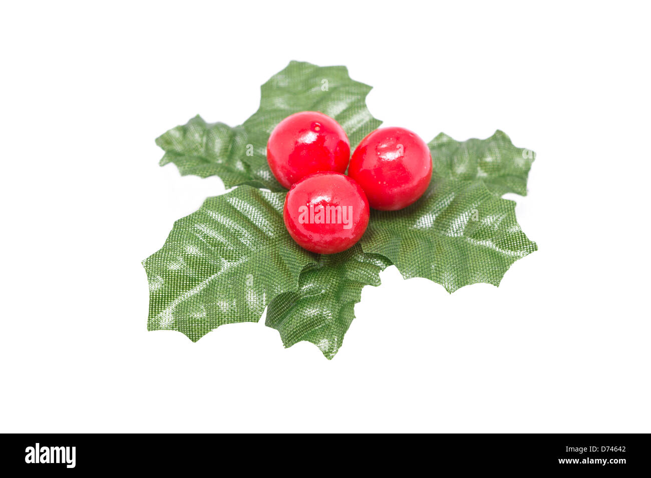 Sprig of Artificial Holly Isolated on White Background Stock Photo - Alamy